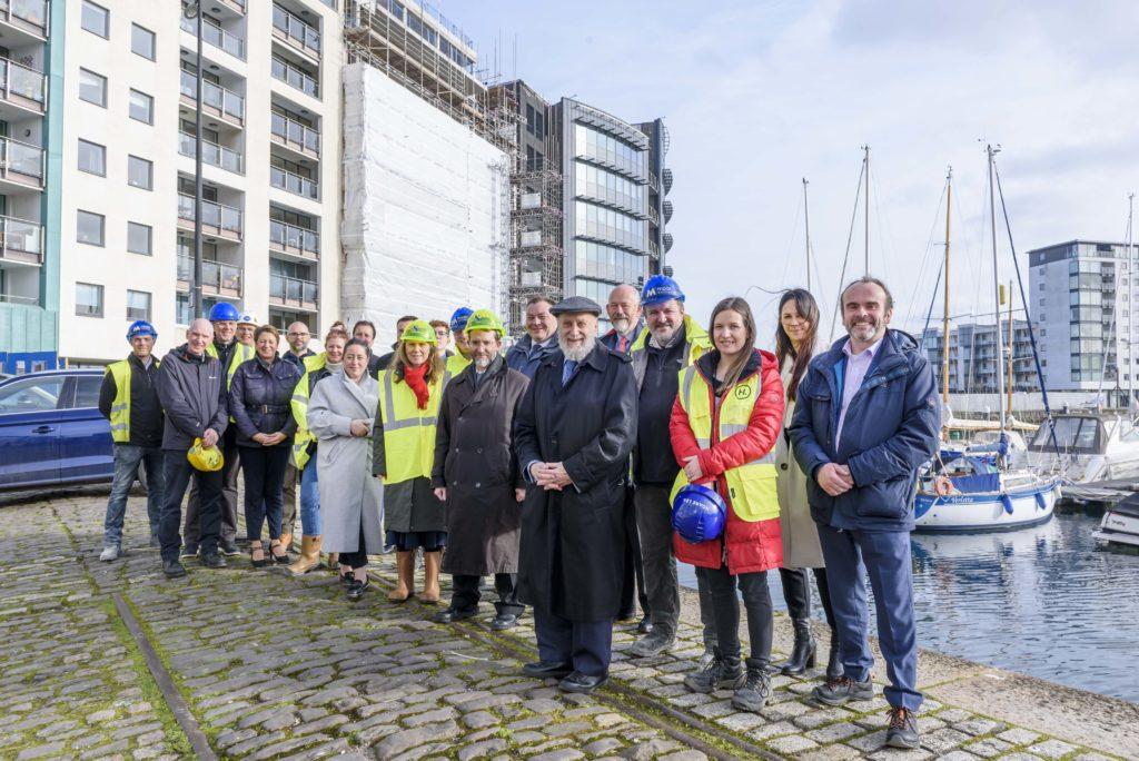 Topping out milestone celebrated for Harbour Arch Quay development