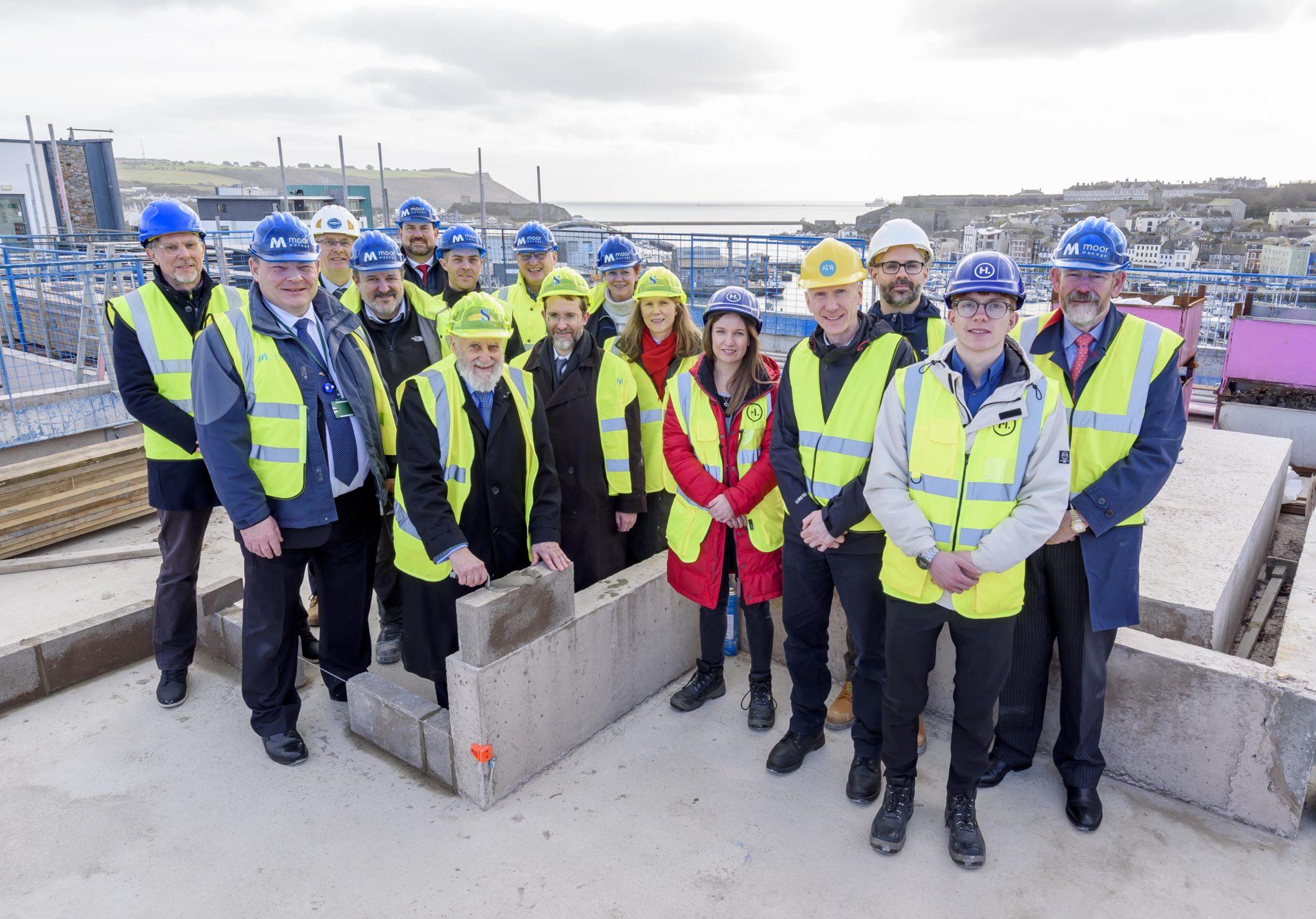 Topping out milestone celebrated for Harbour Arch Quay development